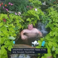Unbothered. Moisturized. Happy. In My Lane. Focused. Flourishing. meme and catchphrase depicting the "pond sage" or "water spirit" with a large man sitting in a pond surrounded by foilage.