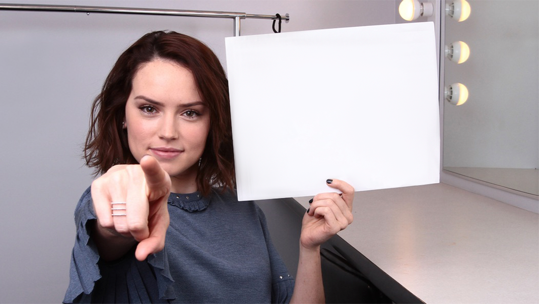 Daisy Ridley holding paper | Know Your Meme