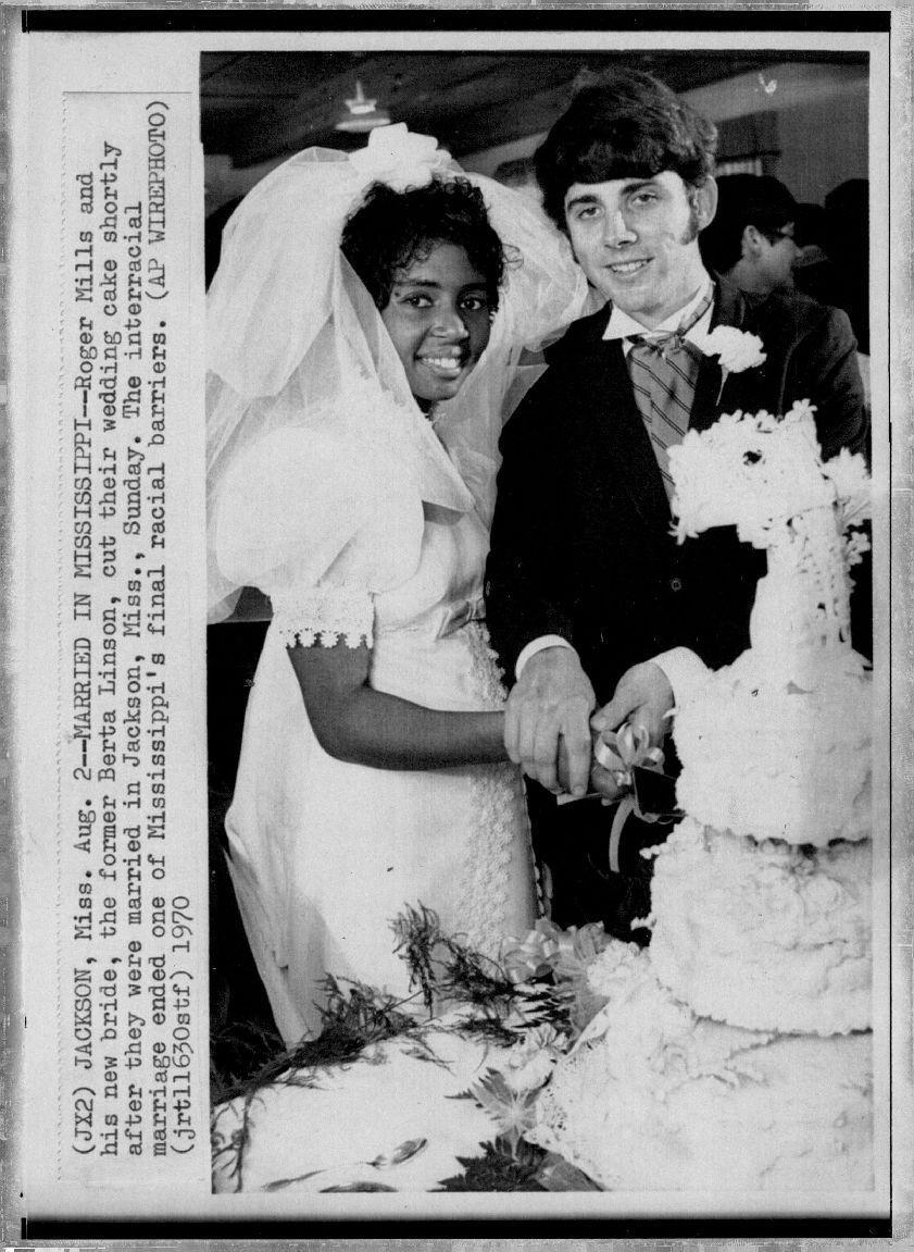 Mississippi's first interracial bride and groom enjoying their wedding ...