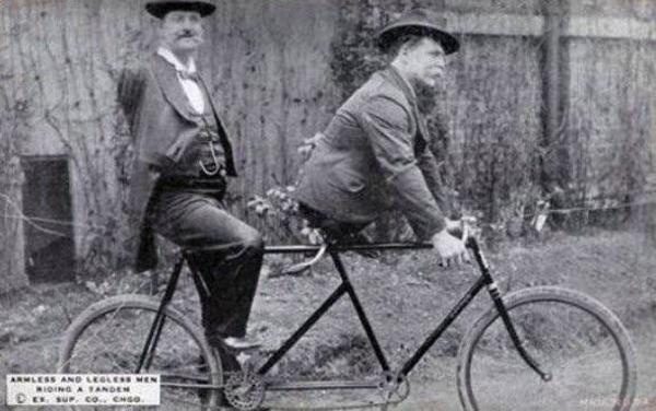 An armless man and a legless man work together to ride a bike. | r ...