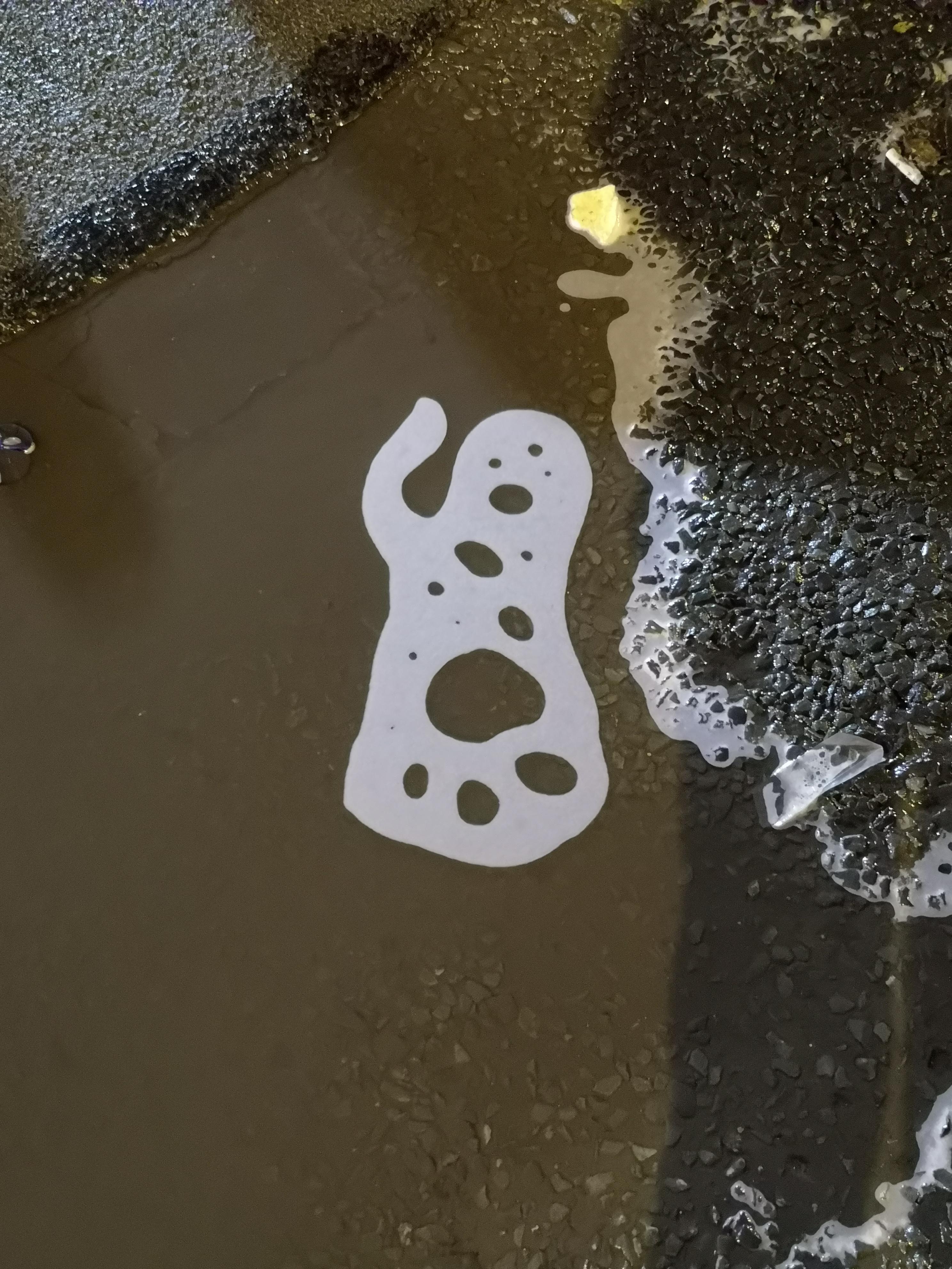The foam on this puddle looks like a waving person | /r ...