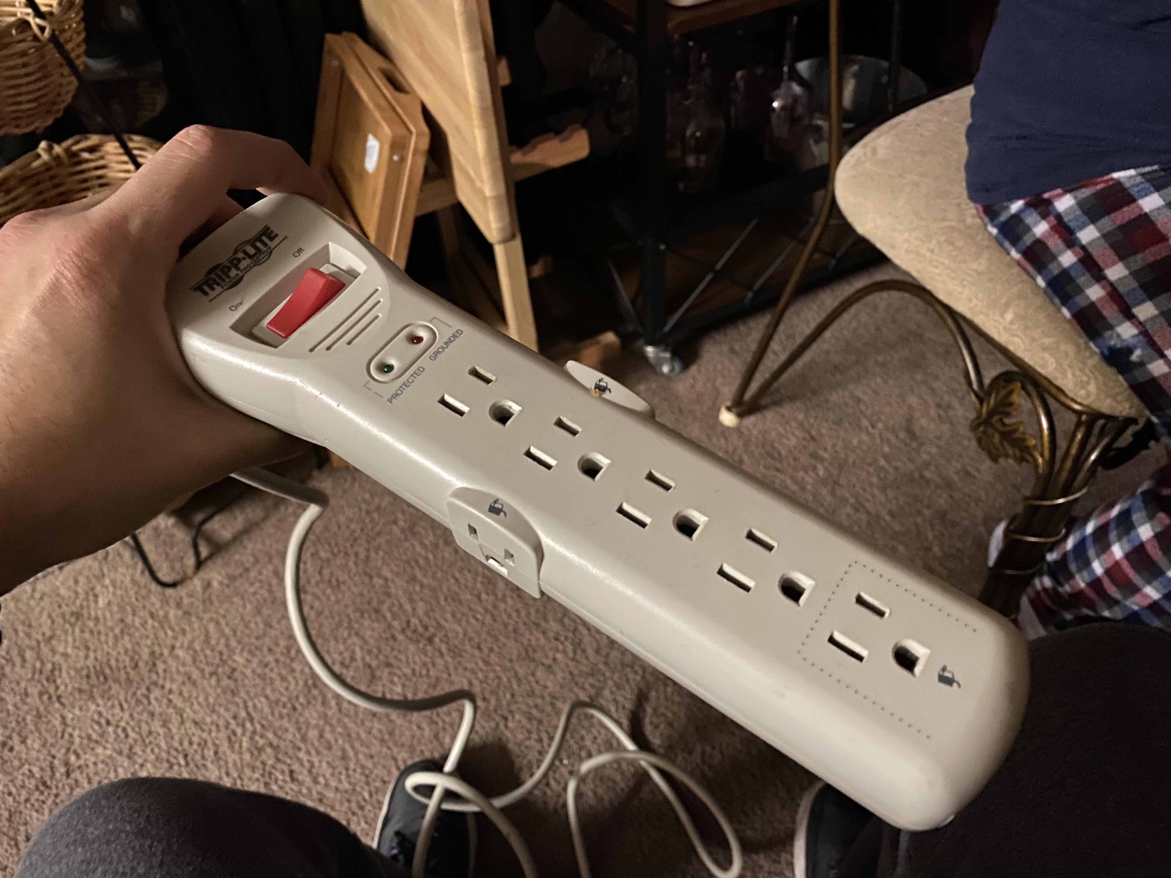 This surge protector has two extra outlets on the sides. | /r ...