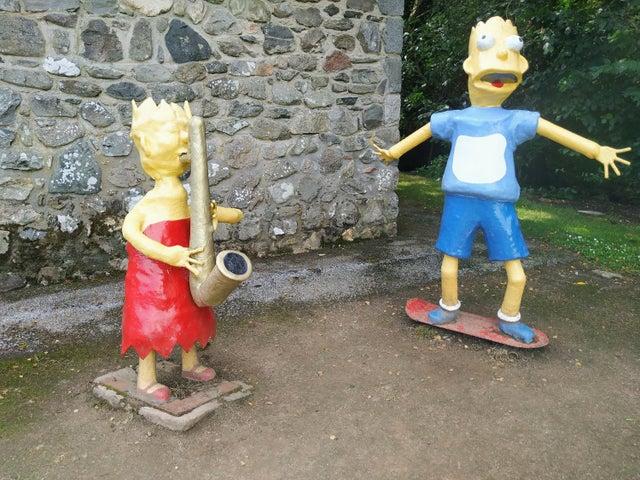 Lisa and Bart Statues | Cursed Images | Know Your Meme