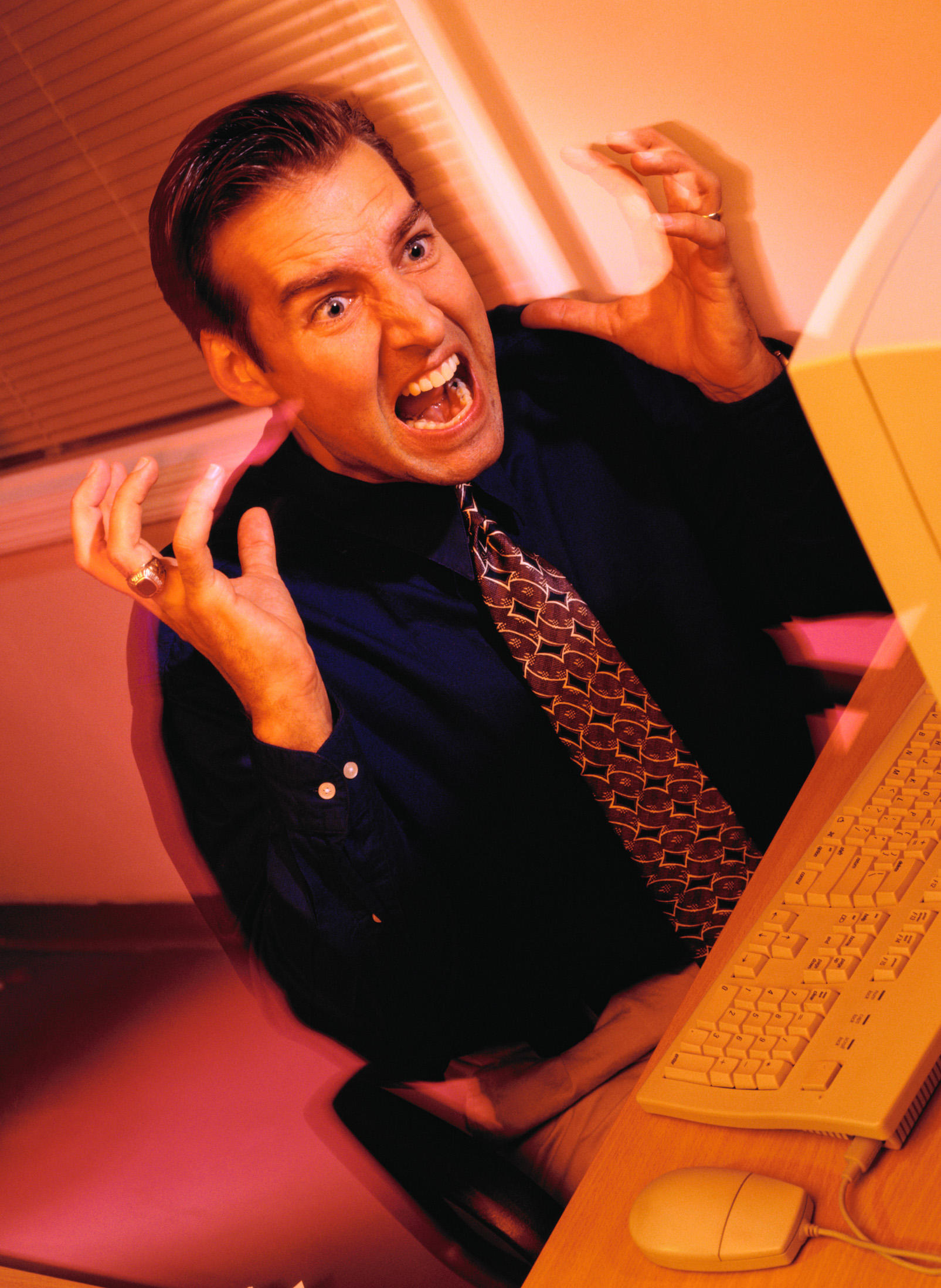 Office employee getting mad at his computer | Stock Photography | Know ...