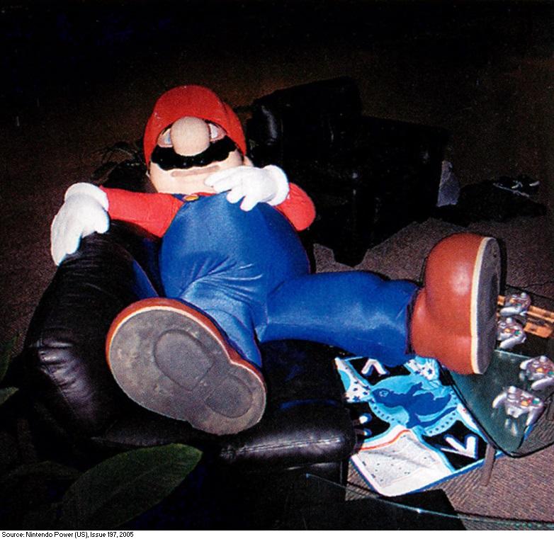 Promotional photo from Nintendo Power showing Mario being exhausted ...