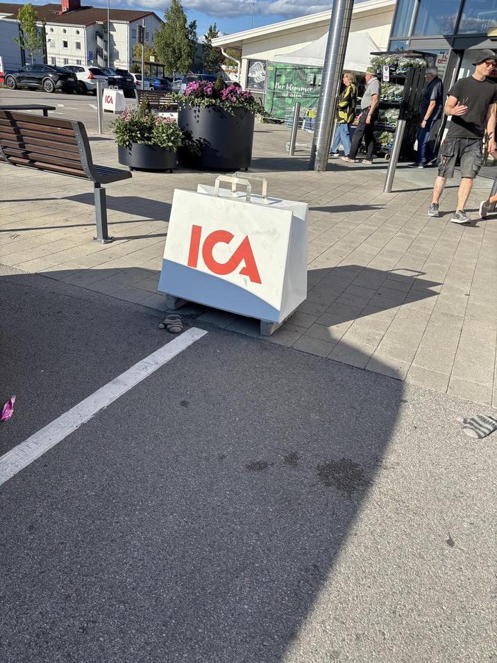 Supermarket barriers shaped as a paper bag | Know Your Meme