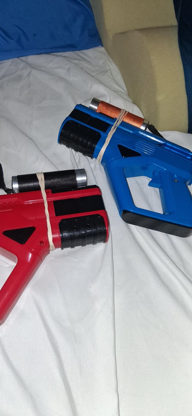My dad rubber banded flashlights to the top of Laser Tag guns, so me ...