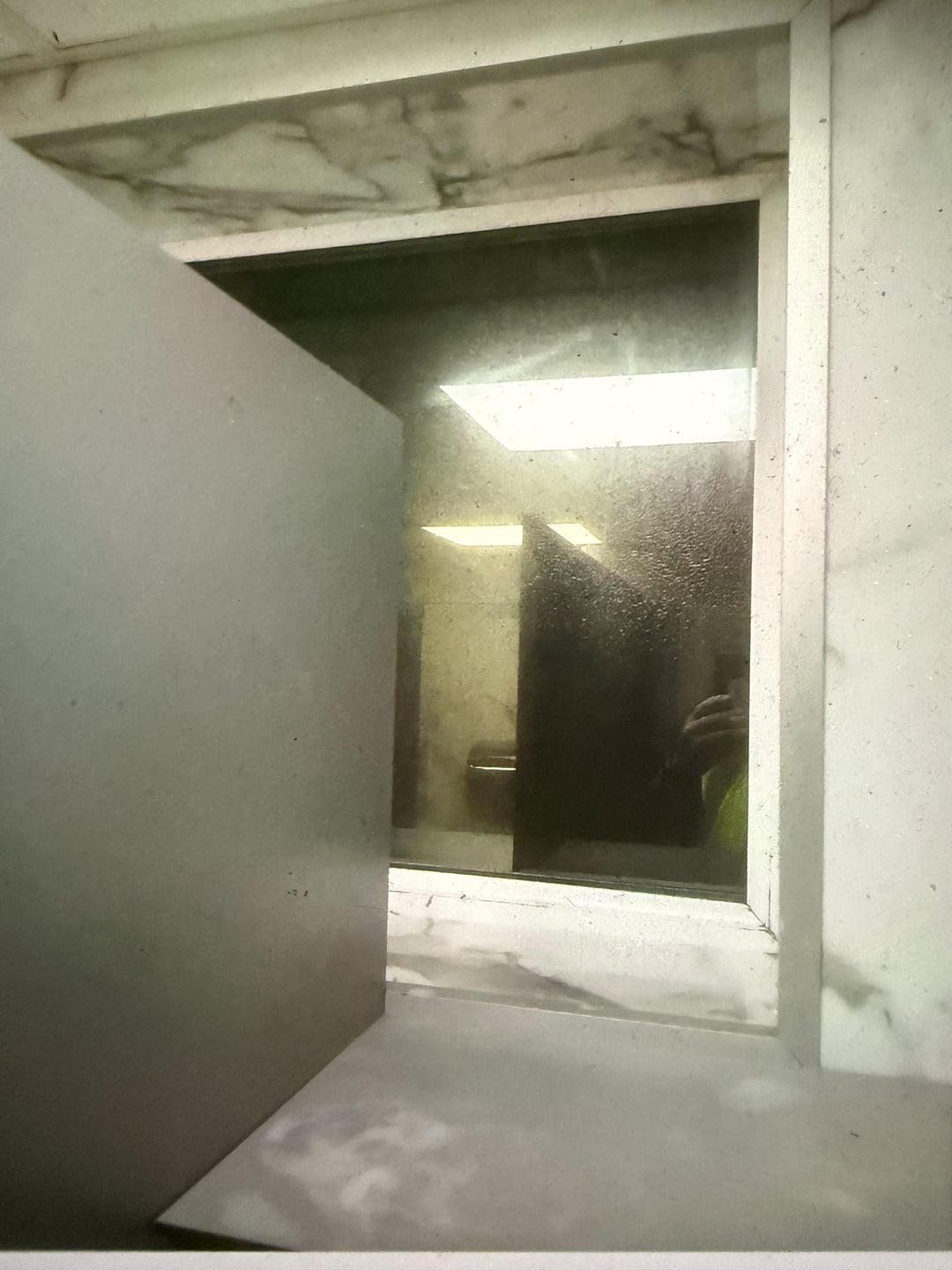 Cubicles where you can see others' reflections | Know Your Meme