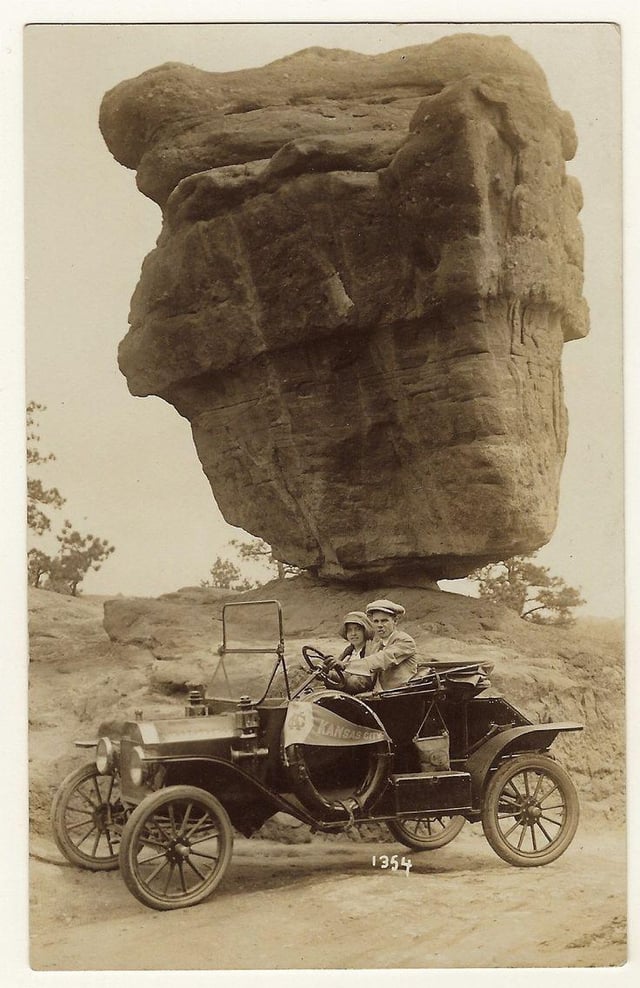 Driving past the rock at the garden of God's Park, Colorado, 1920 ...