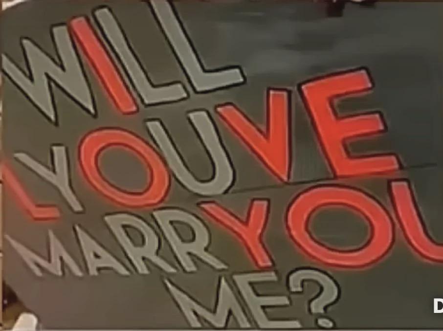 This sign that mixed 'I love you' and 'will you marry me' | Know Your Meme
