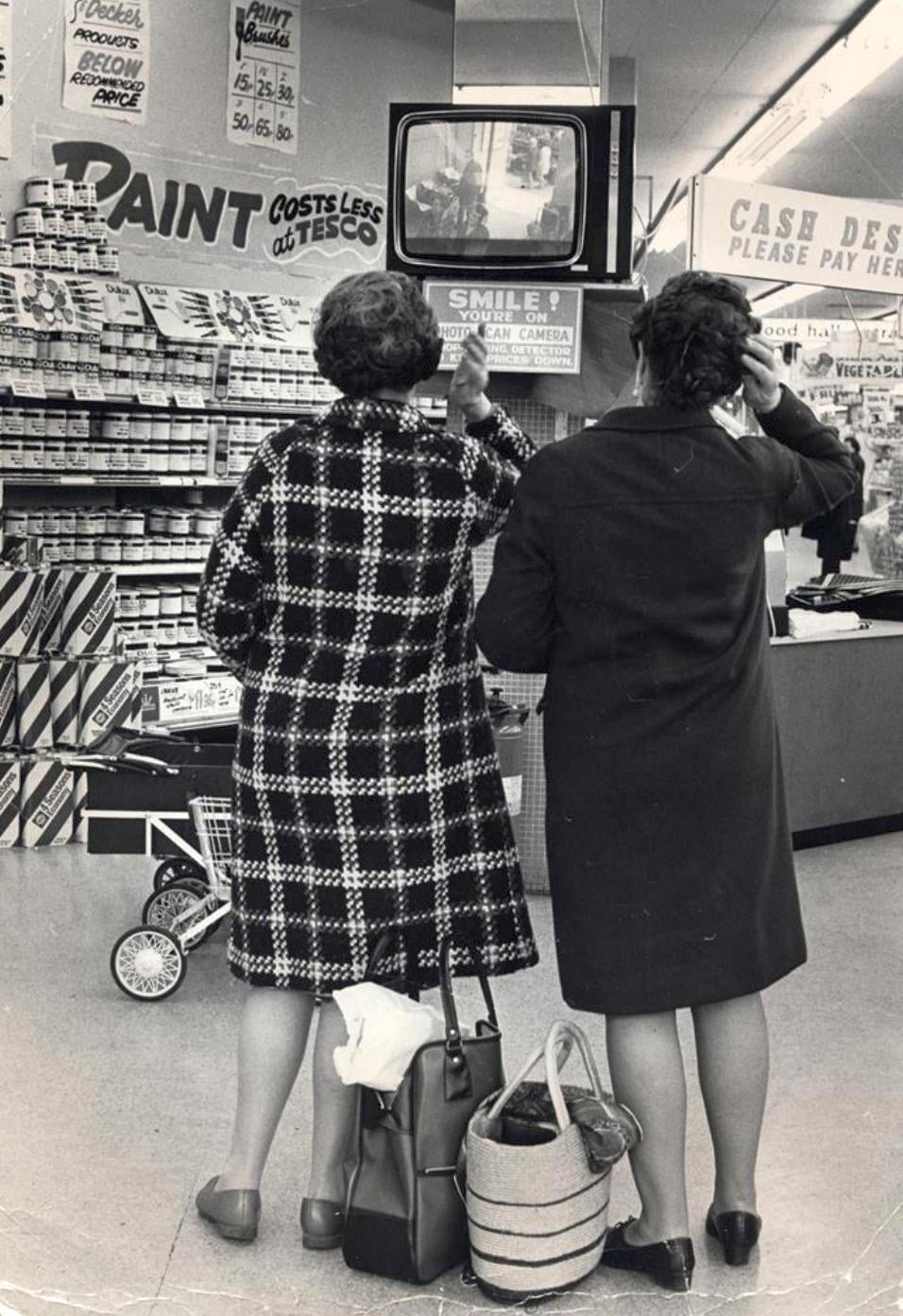 Two ladies watch CCTV in Tesco, 1971 | Know Your Meme